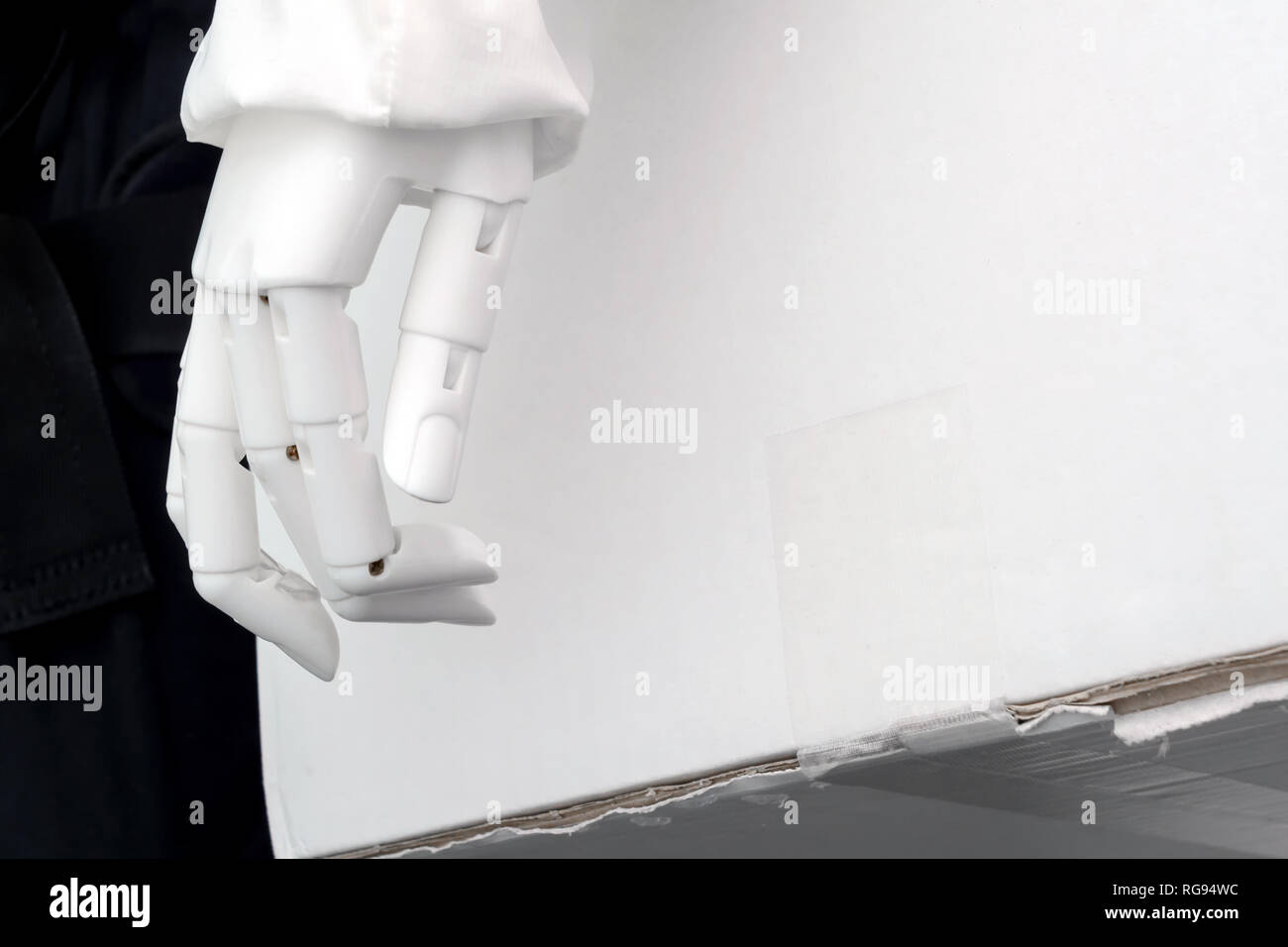 Robot arm carry heavy box. Robotic wearable muscle suit and artificial ...