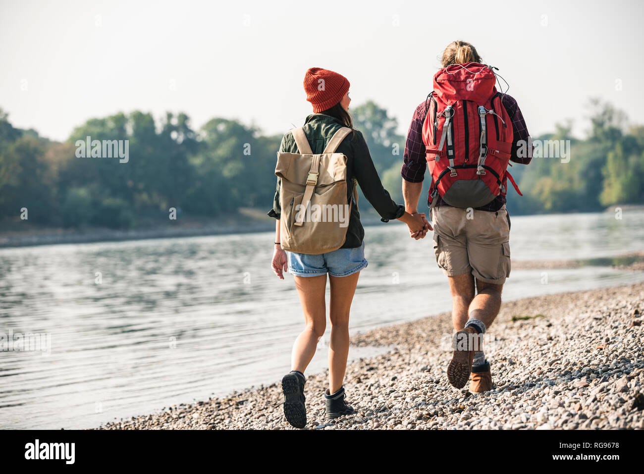 Young couple walking rear view hi-res stock photography and images - Alamy