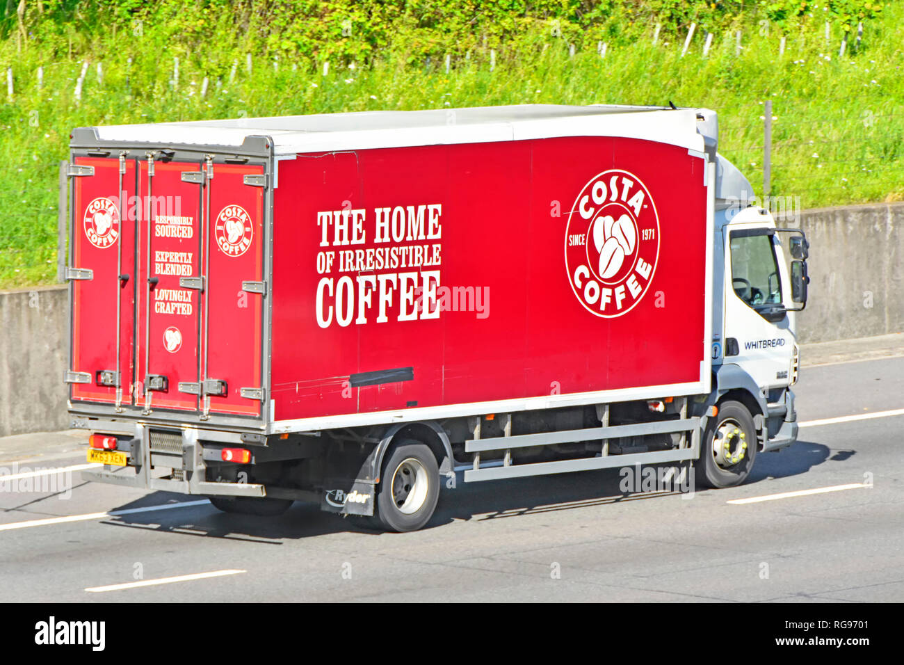 Back side view of red white Whitbread Costa Coffee business brand supply chain via shop delivery lorry truck driving along motorway England UK Stock Photo Alamy