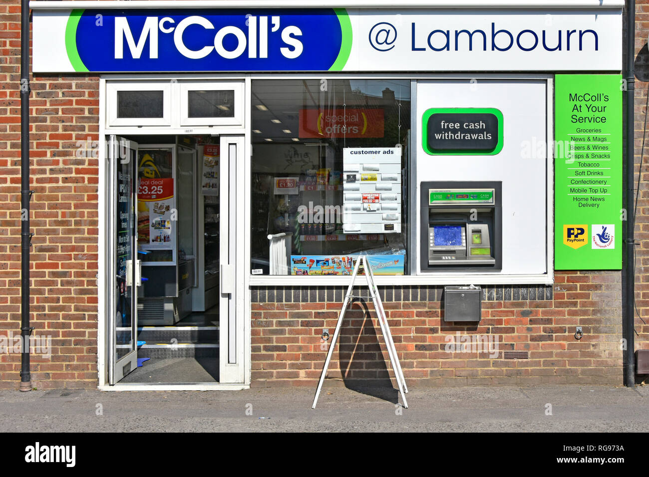 McColls convenience store & newsagent shop front window with PayPoint ...