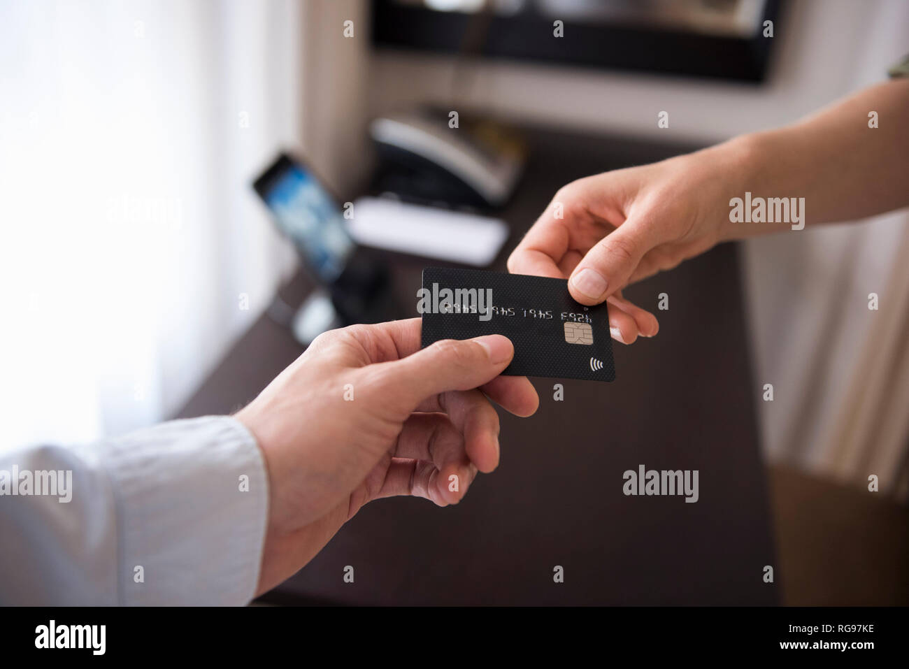 Handing hi-res stock photography and images - Alamy