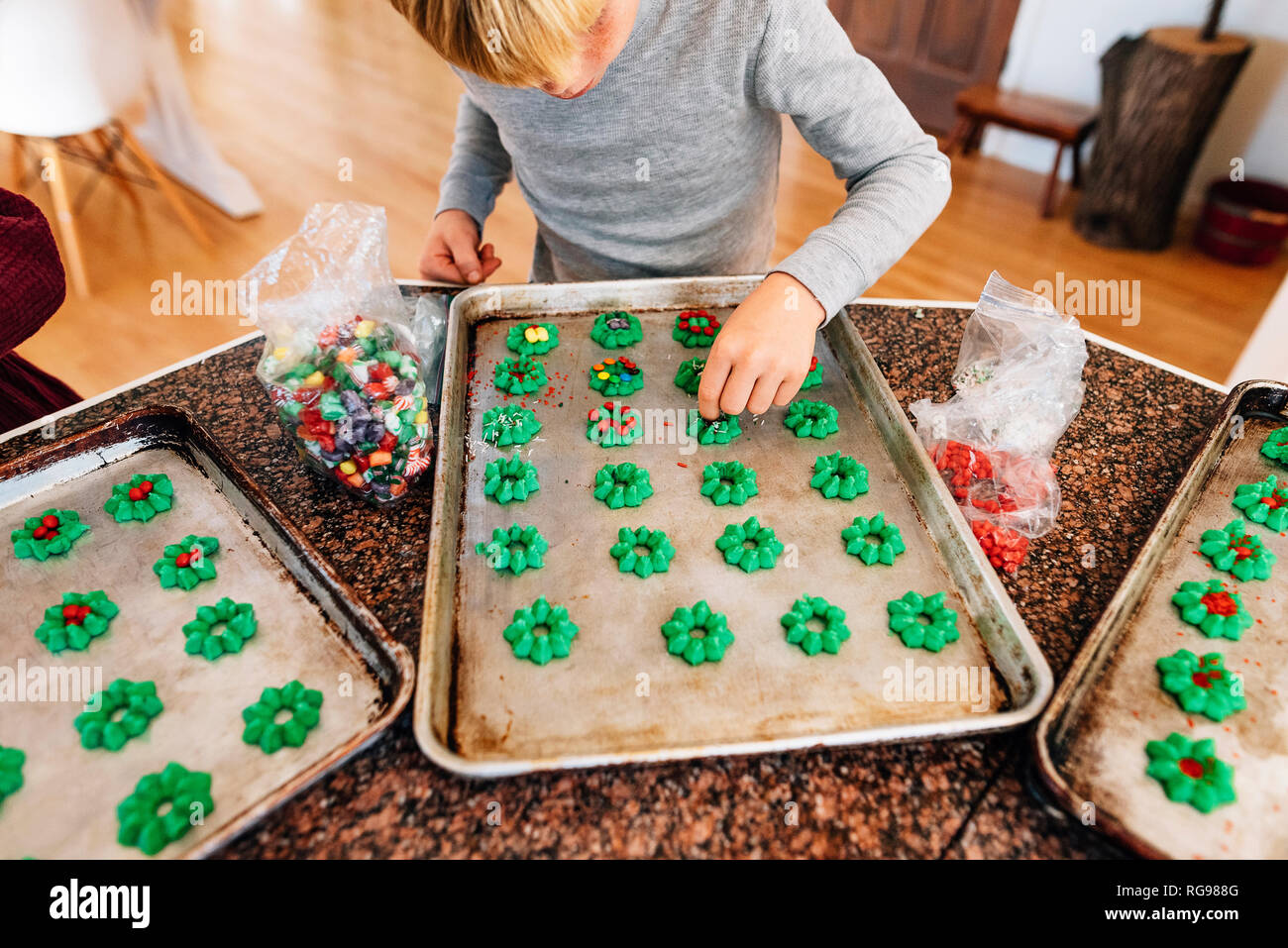 Boy decorating biscuit hi-res stock photography and images - Alamy