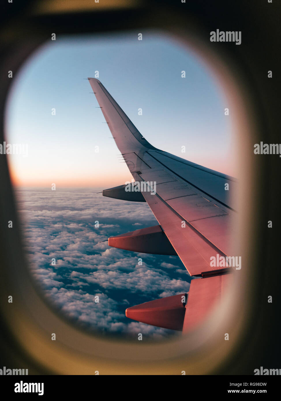 Airplane wing through an airplane window Stock Photo - Alamy
