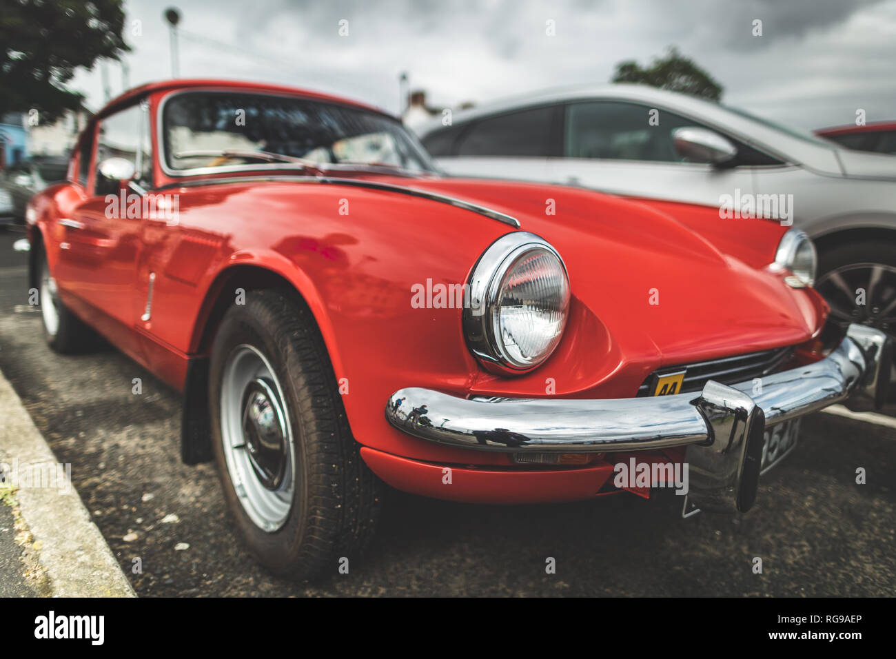Close-up vintage red car. Northern Ireland. Bright scene the scarlet ...