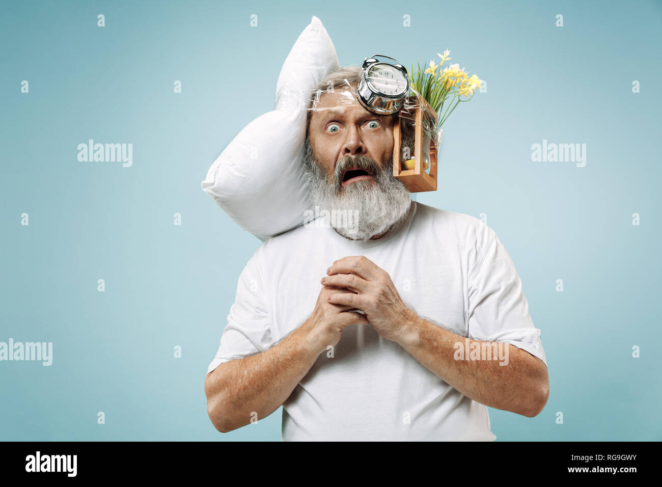 Surprised senior man screaming after sleeping at home or office having ...