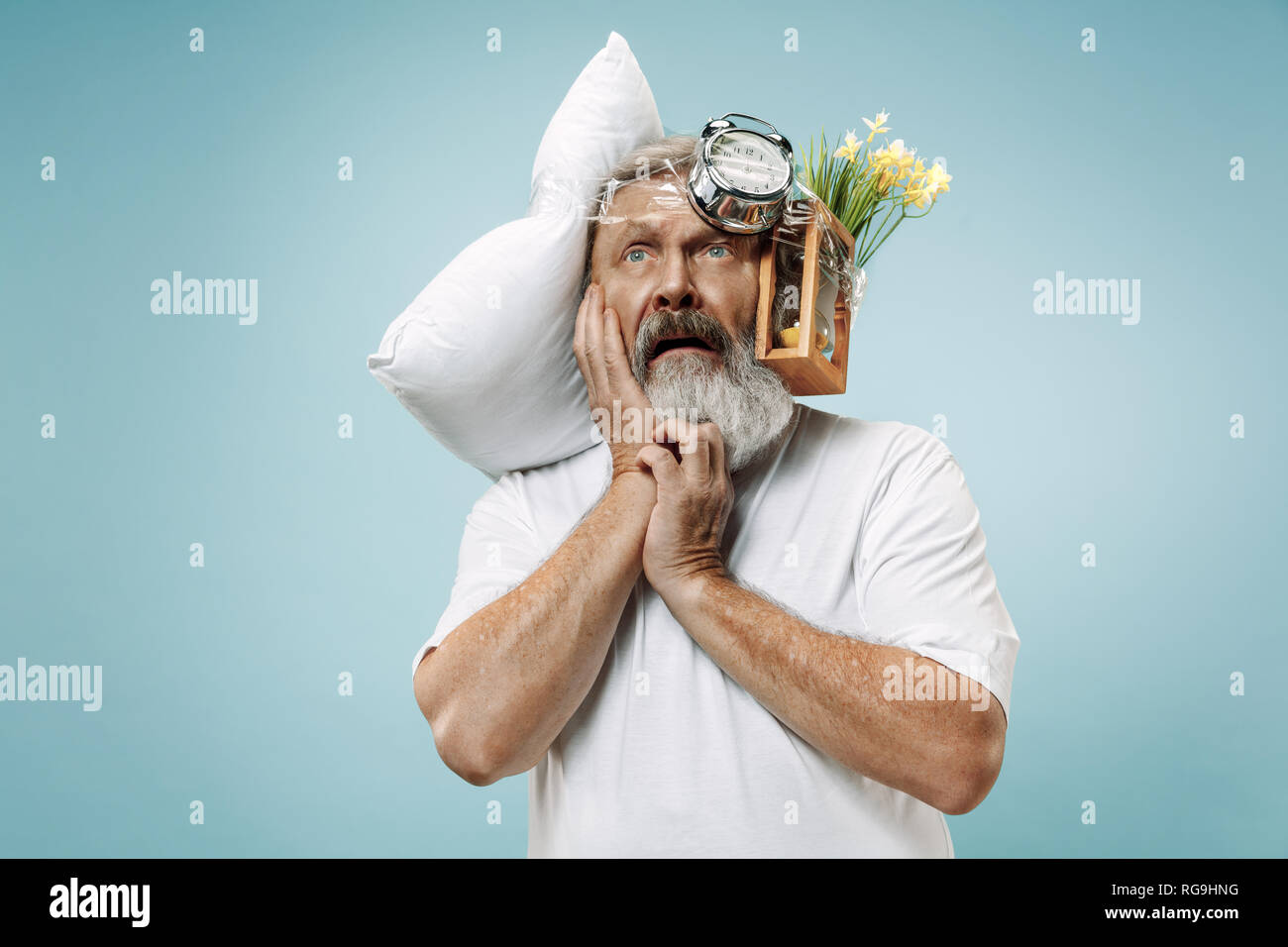 Surprised senior man screaming after sleeping at home or office having ...