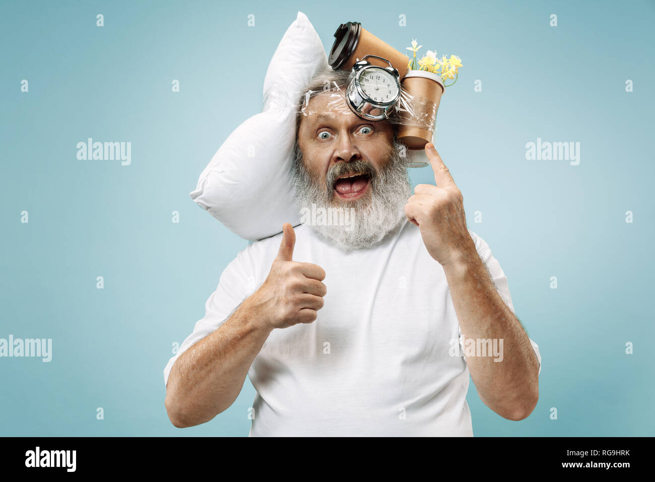 Surprised senior man screaming after sleeping at home or office having ...