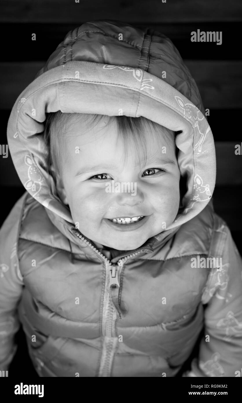Young toddler female of just over two years old having fun smiling ...