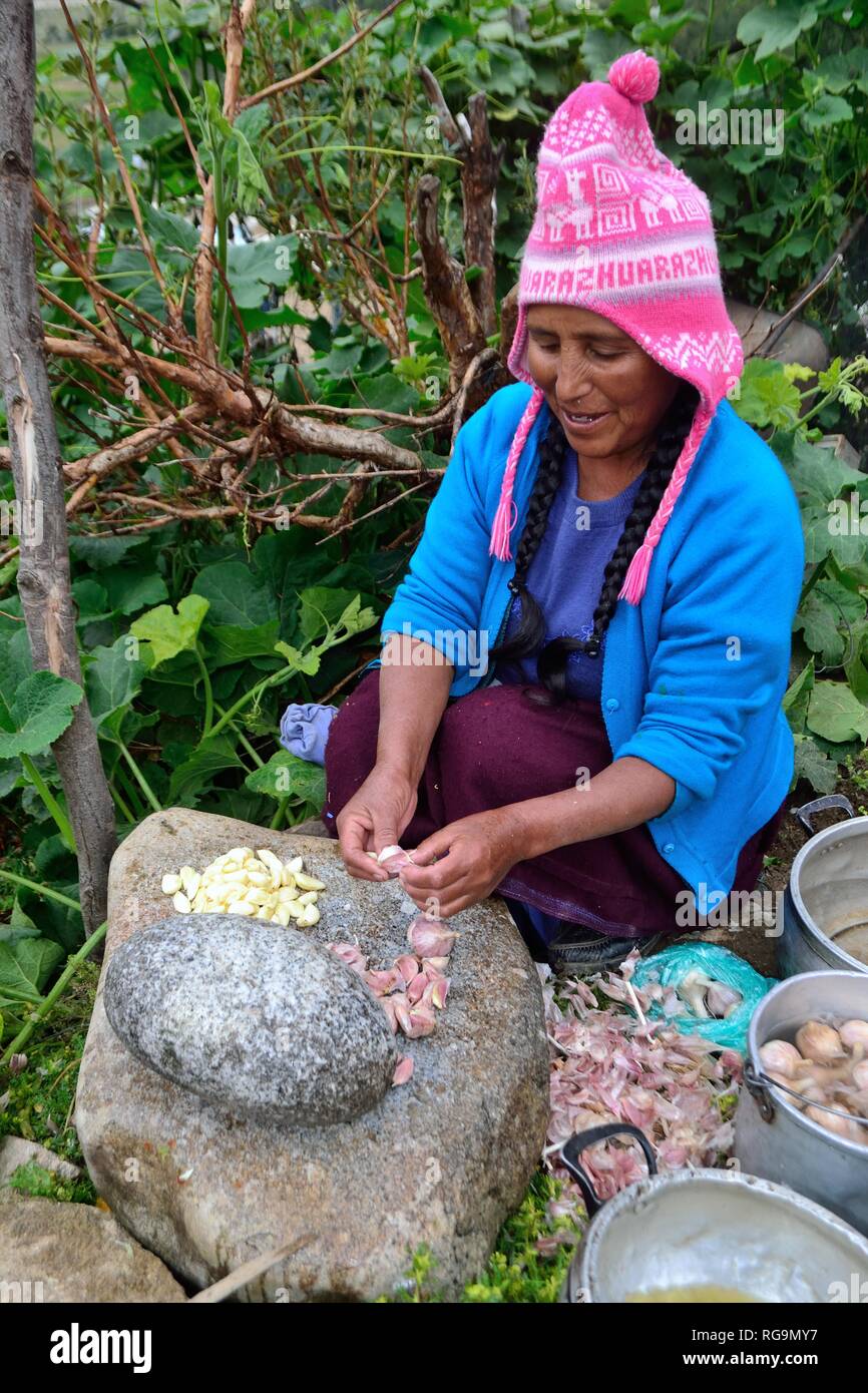 Grinding Garlic in Huashao - National park HUASCARAN. Department of ...