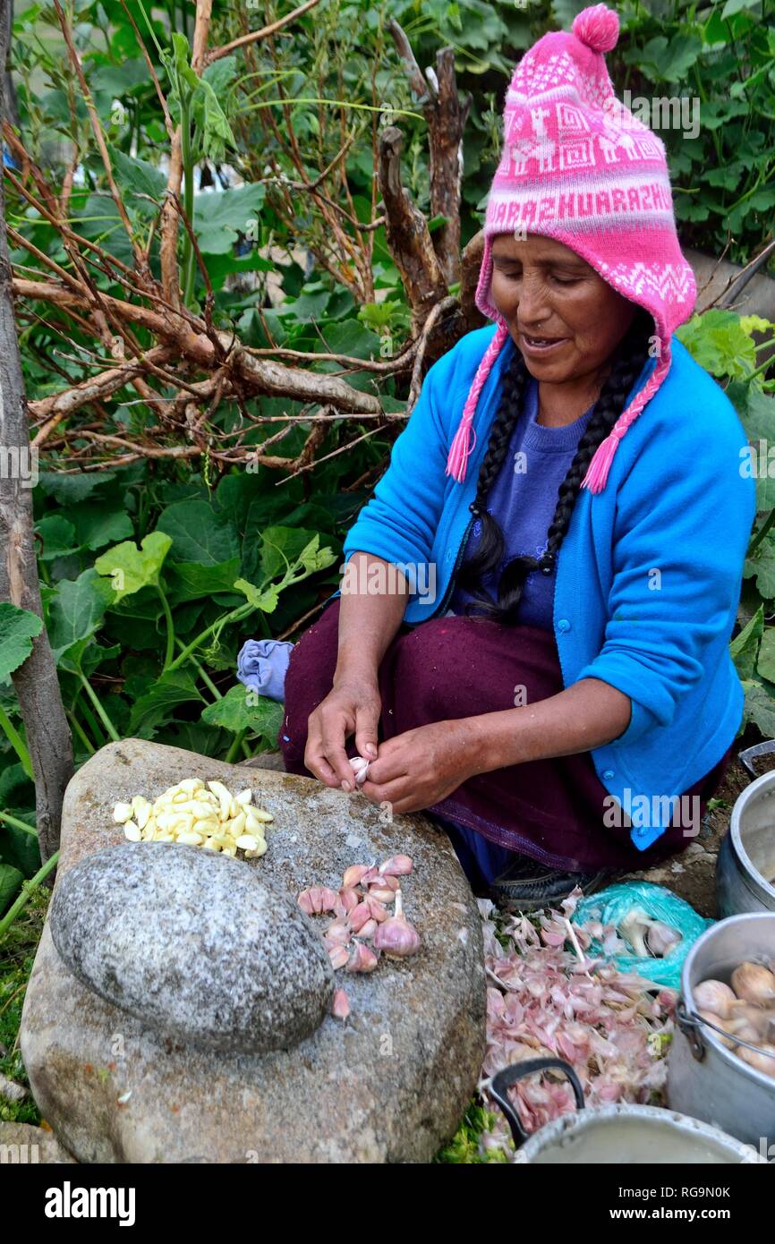 Grinding Garlic in Huashao - National park HUASCARAN. Department of ...