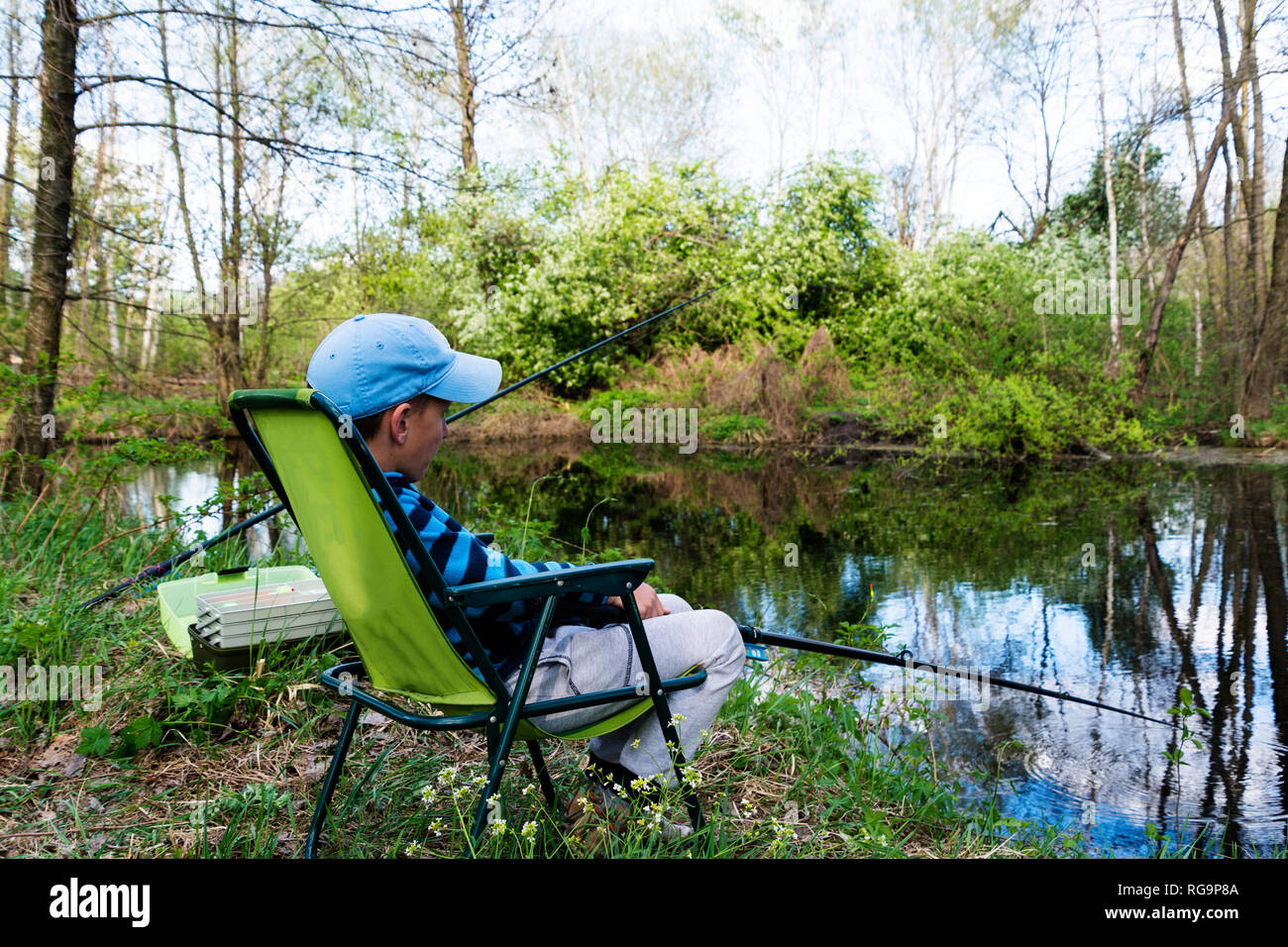 Kid holding fishing pole hi-res stock photography and images - Alamy