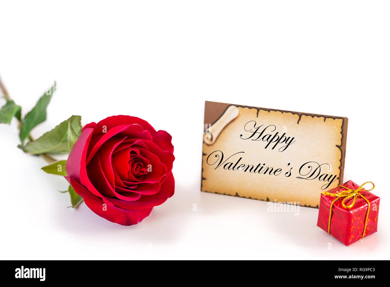 Greeting card with single red rose and gift box on pure white ...