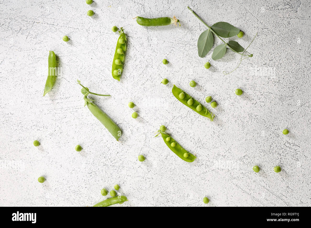 Green peas pod on white background Stock Photo - Alamy