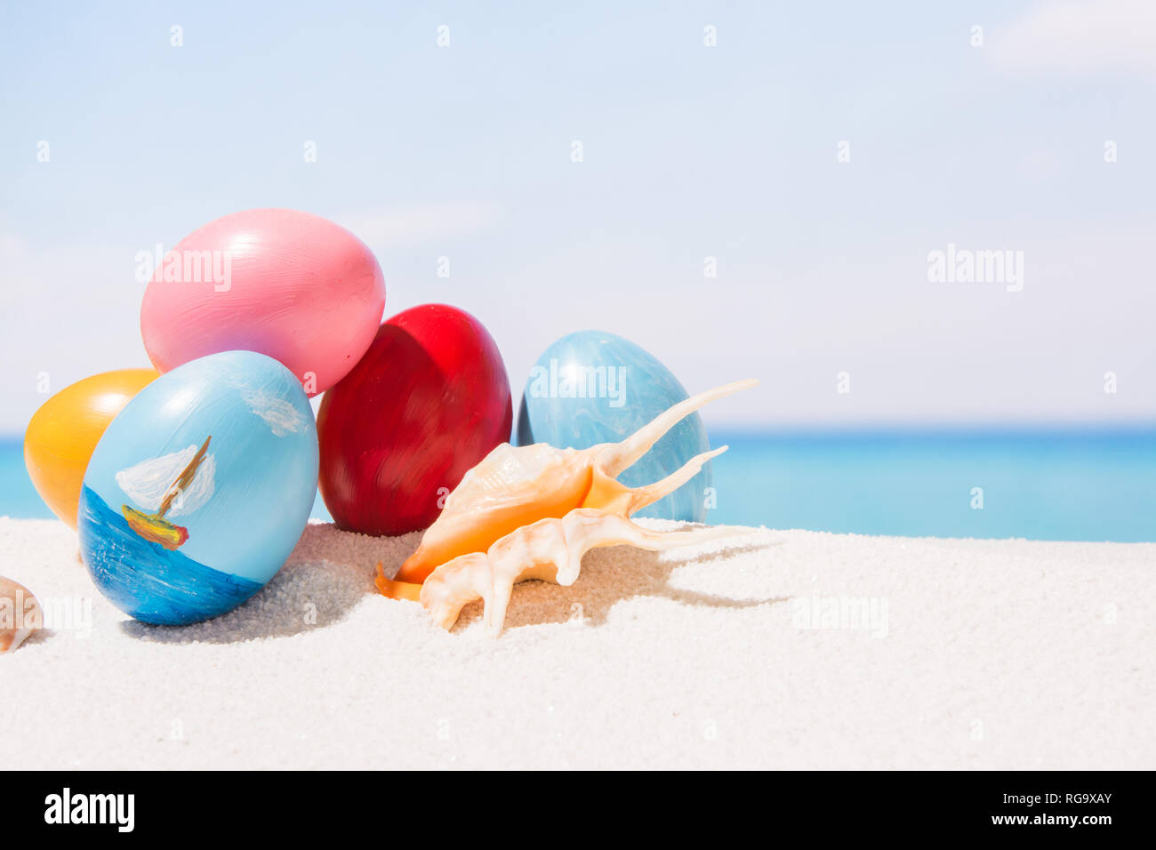 Easter on tropical beach background. Eggs on the white sand. Vacation ...