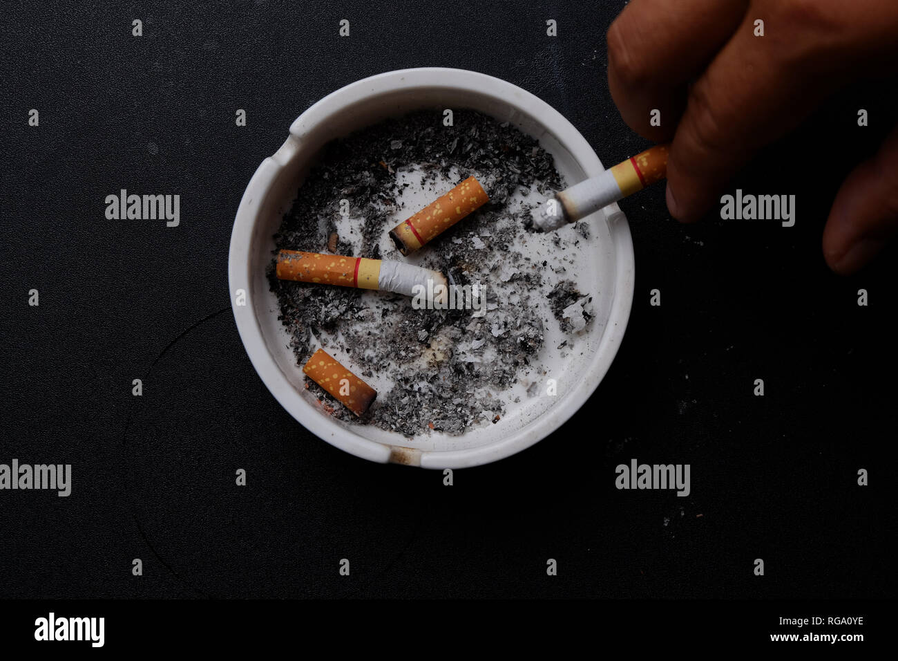 Cigarettes in ashtray Stock Photo - Alamy