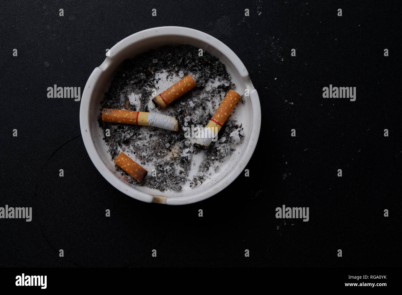 Cigarettes in ashtray Stock Photo - Alamy