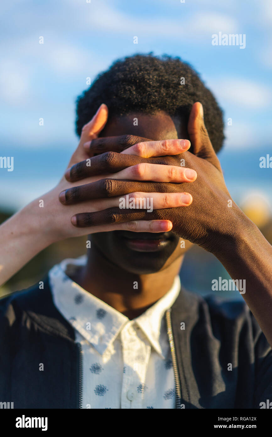 Man covering eyes of woman with his hand surprise hi-res stock ...