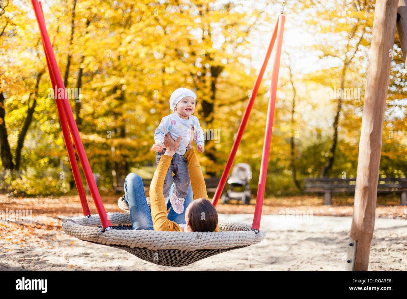 Woman and child autumn swing hi-res stock photography and images - Alamy