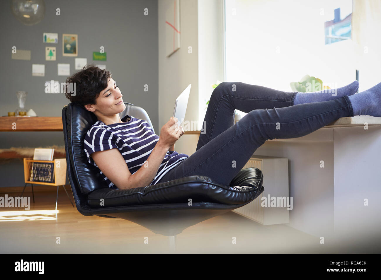 Relaxed woman enjoying online leisure hi-res stock photography and ...