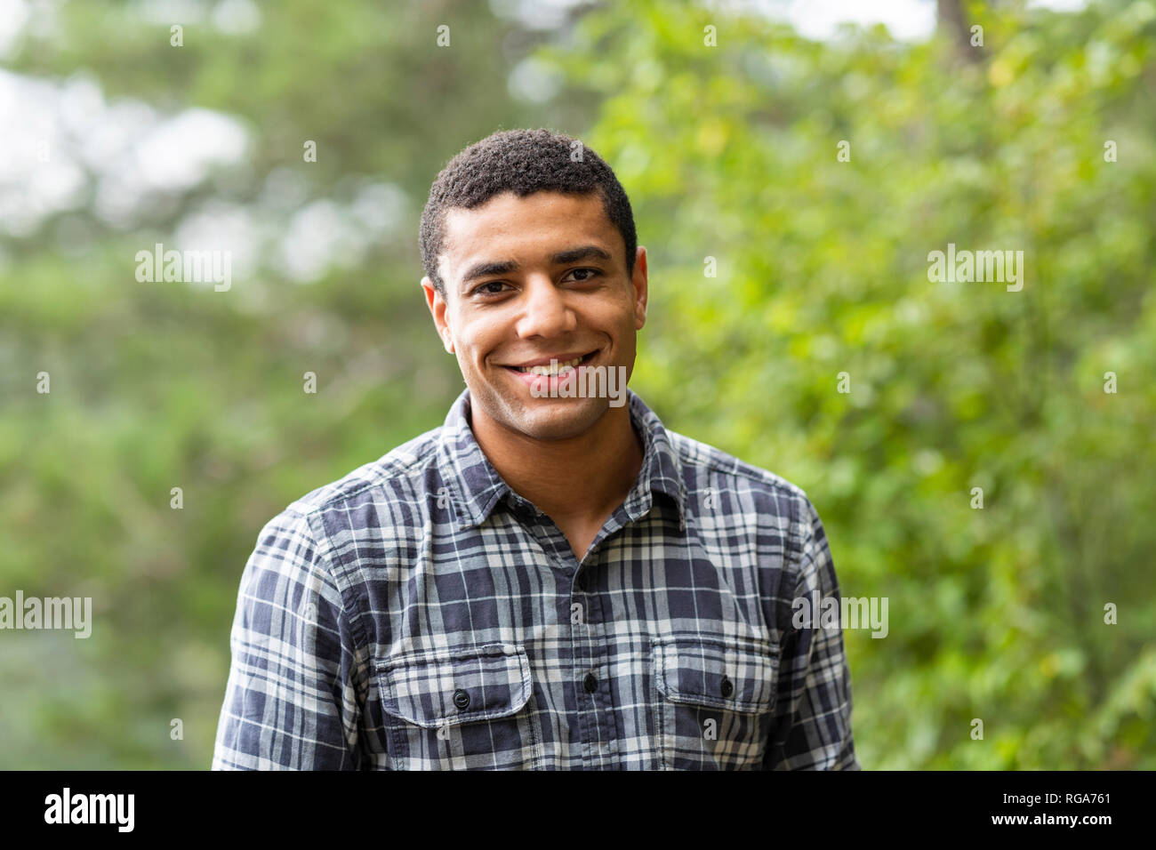 Portrait smiling young man outdoors hi-res stock photography and images ...