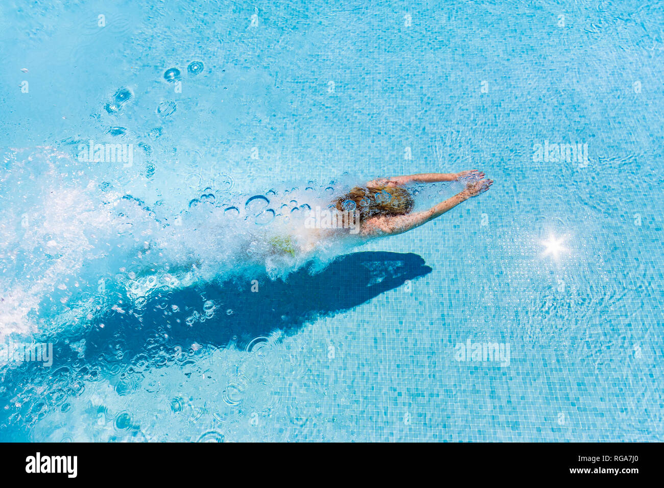 Woman diving into swimming pool hi-res stock photography and images - Alamy