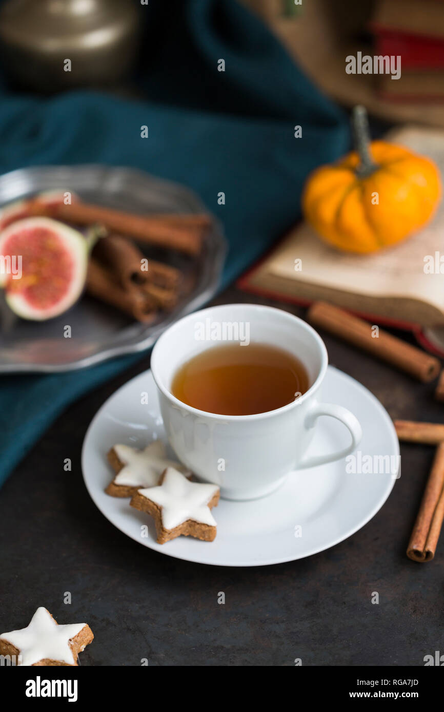 Cup of tea and cinnamon stars Stock Photo - Alamy