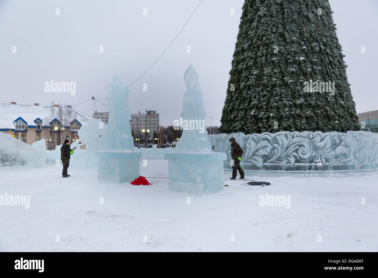 Electricians mount a power cable to illuminate ice figures Stock Photo ...