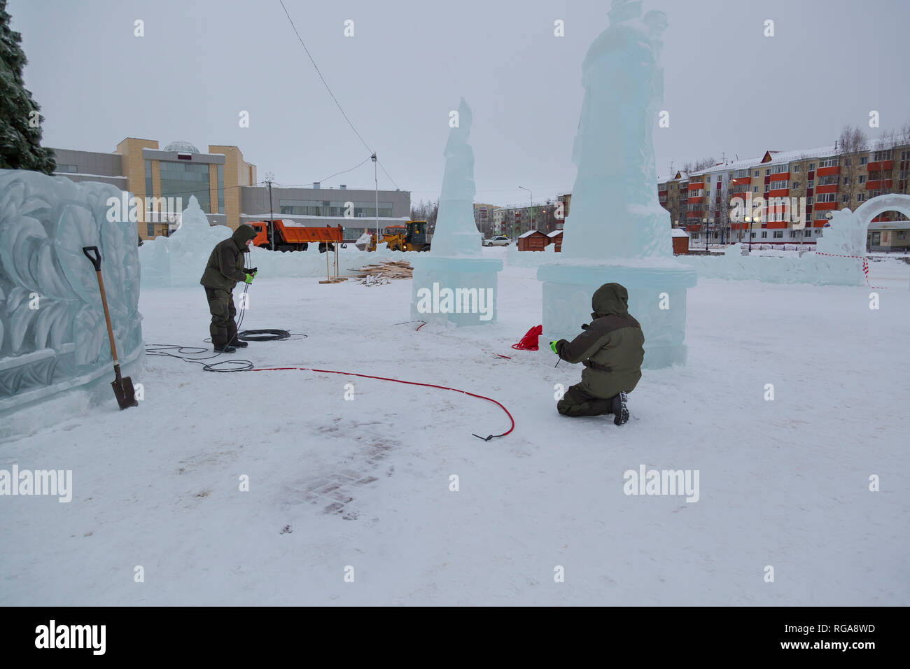 Electricians mount a power cable to illuminate ice figures Stock Photo ...