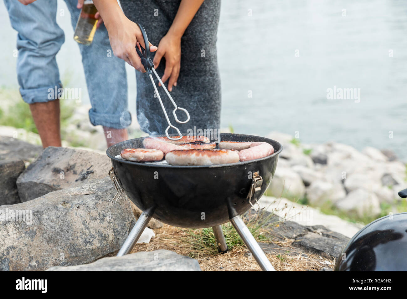 Close up couple having barbecue riverside hi-res stock photography and ...