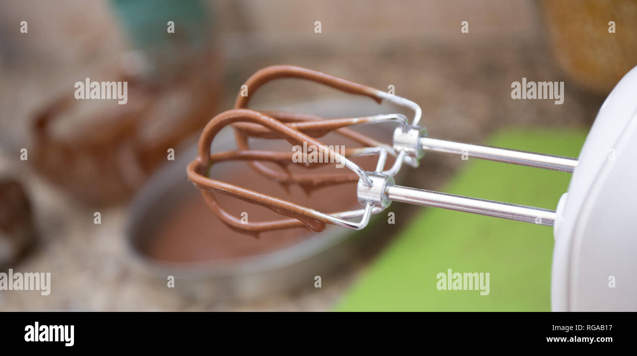Licking the cake beaters hi-res stock photography and images - Alamy