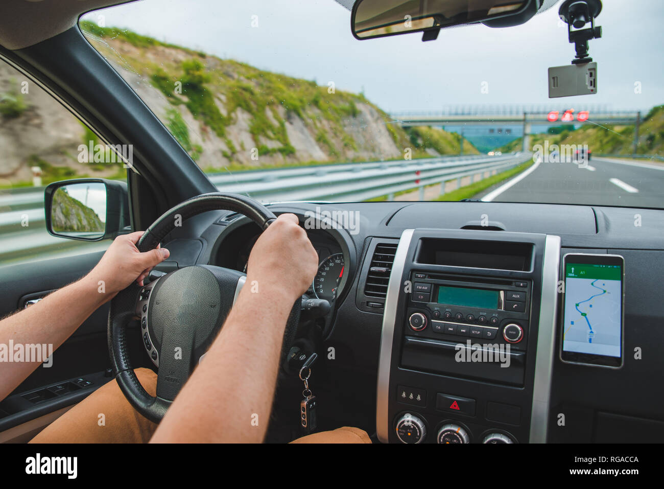 man driving car by speedway. road trip Stock Photo - Alamy