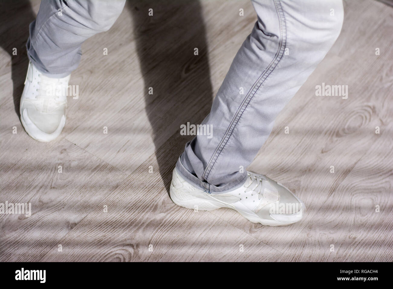 Legs of modern style male dancer. Young man in dynamic pose, cropped ...