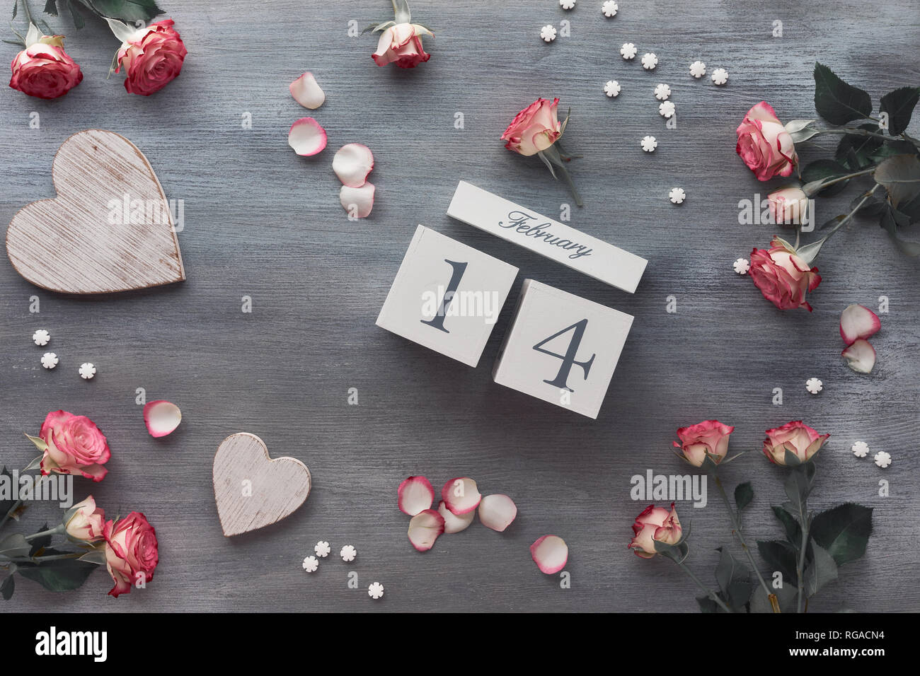 Valentine's day celebration, flat lay with wooden calendar, pink roses ...