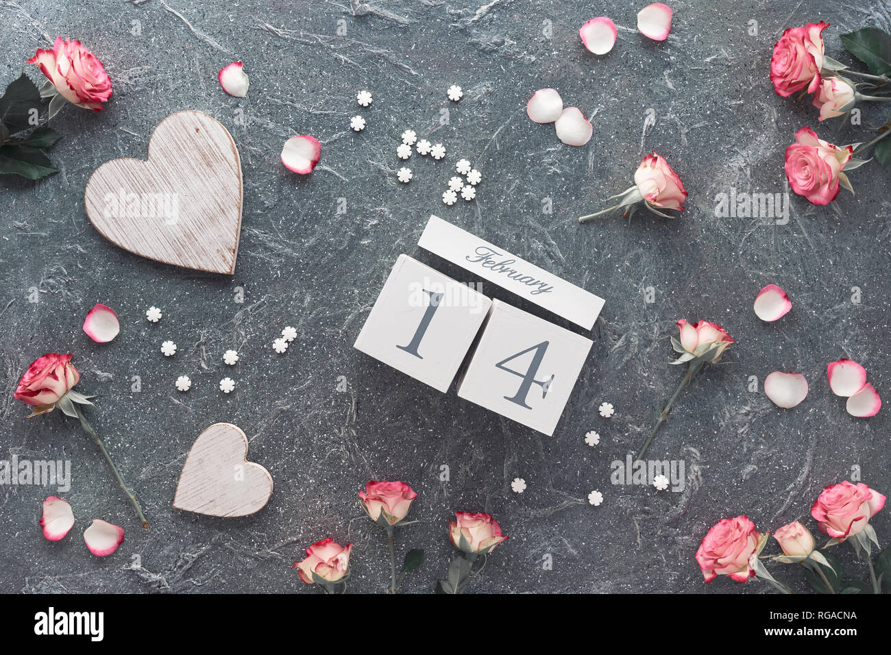 Valentine's day celebration, flat lay with wooden calendar, pink roses ...