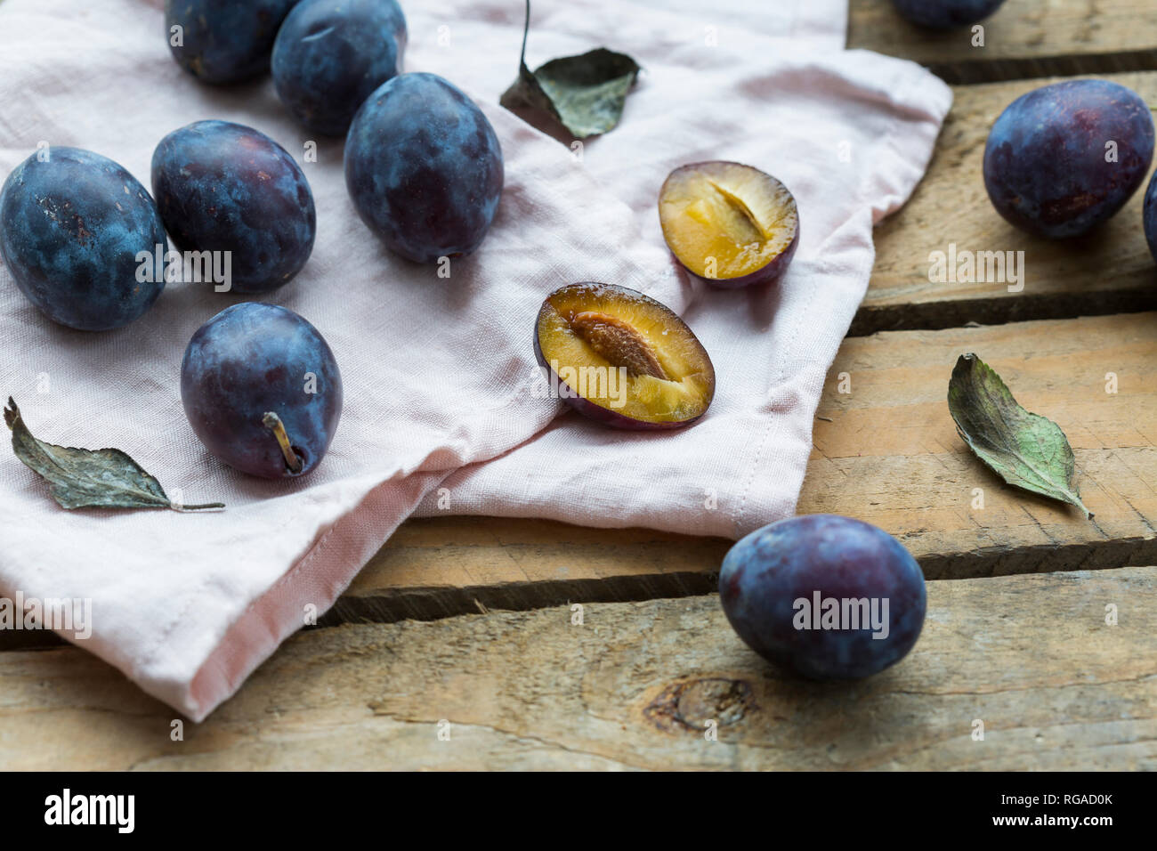 Whole and sliced plums Stock Photo - Alamy