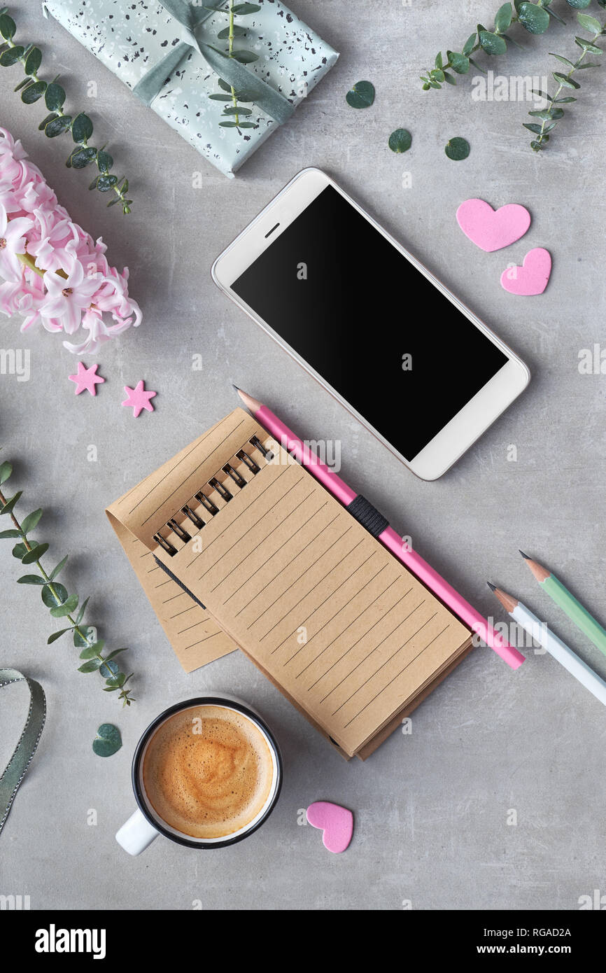 Springtime flat lay with pearl hyacinth flowers, eucalyptus, mobile ...