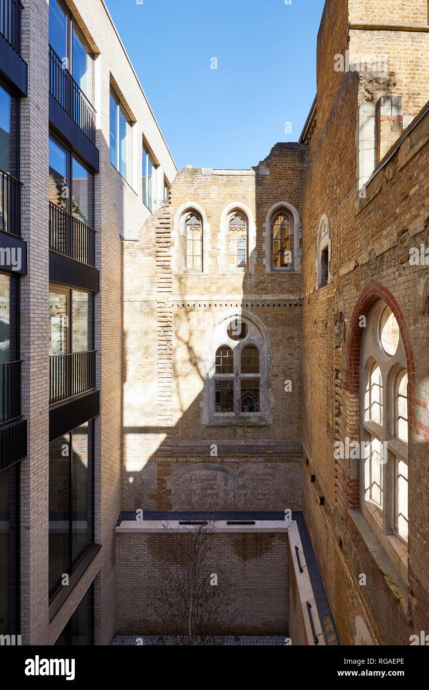 Courtyard enclosed by new and historic facade. Paul Street, London ...