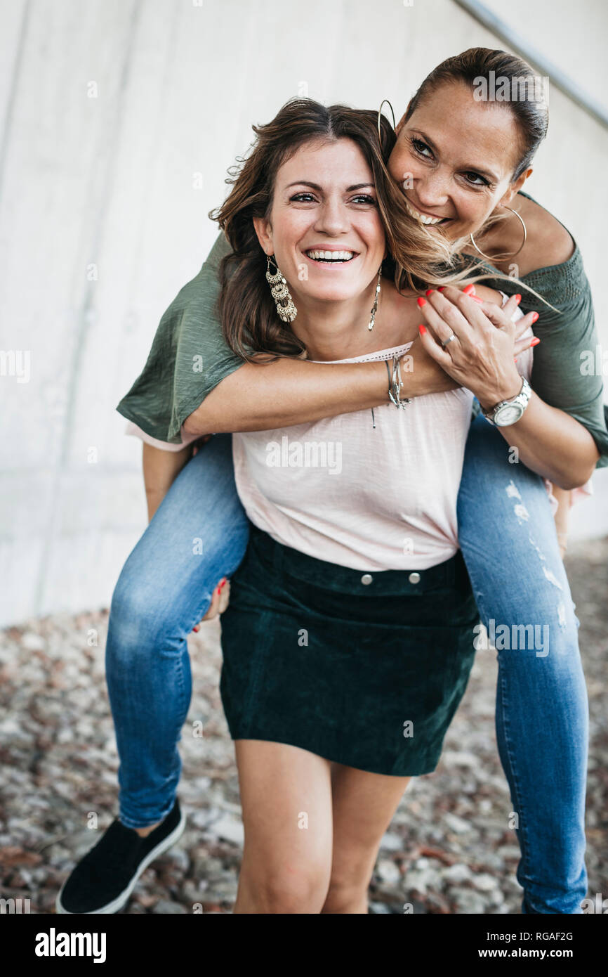 Best friends having fun together, carrying piggyback Stock Photo - Alamy