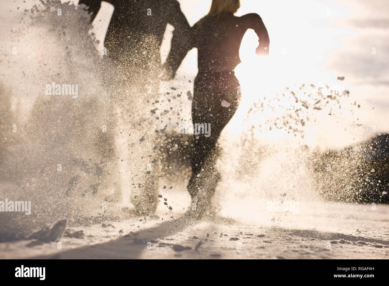Man running through the snow hi-res stock photography and images - Alamy