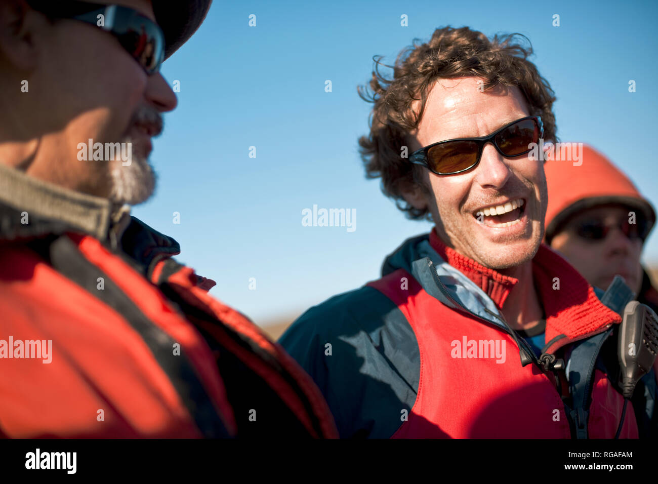 Two men sharing a joke together while sightseeing Stock Photo - Alamy