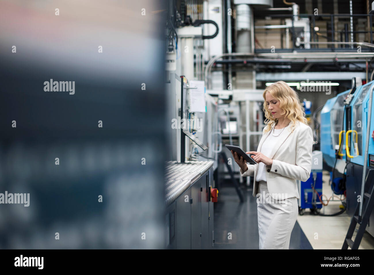 Woman using machine hi-res stock photography and images - Alamy