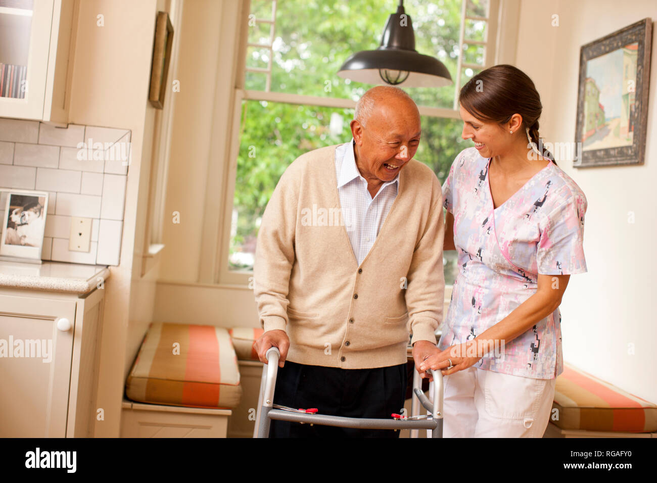 Senior man receiving a visit at home from his nurse Stock Photo - Alamy