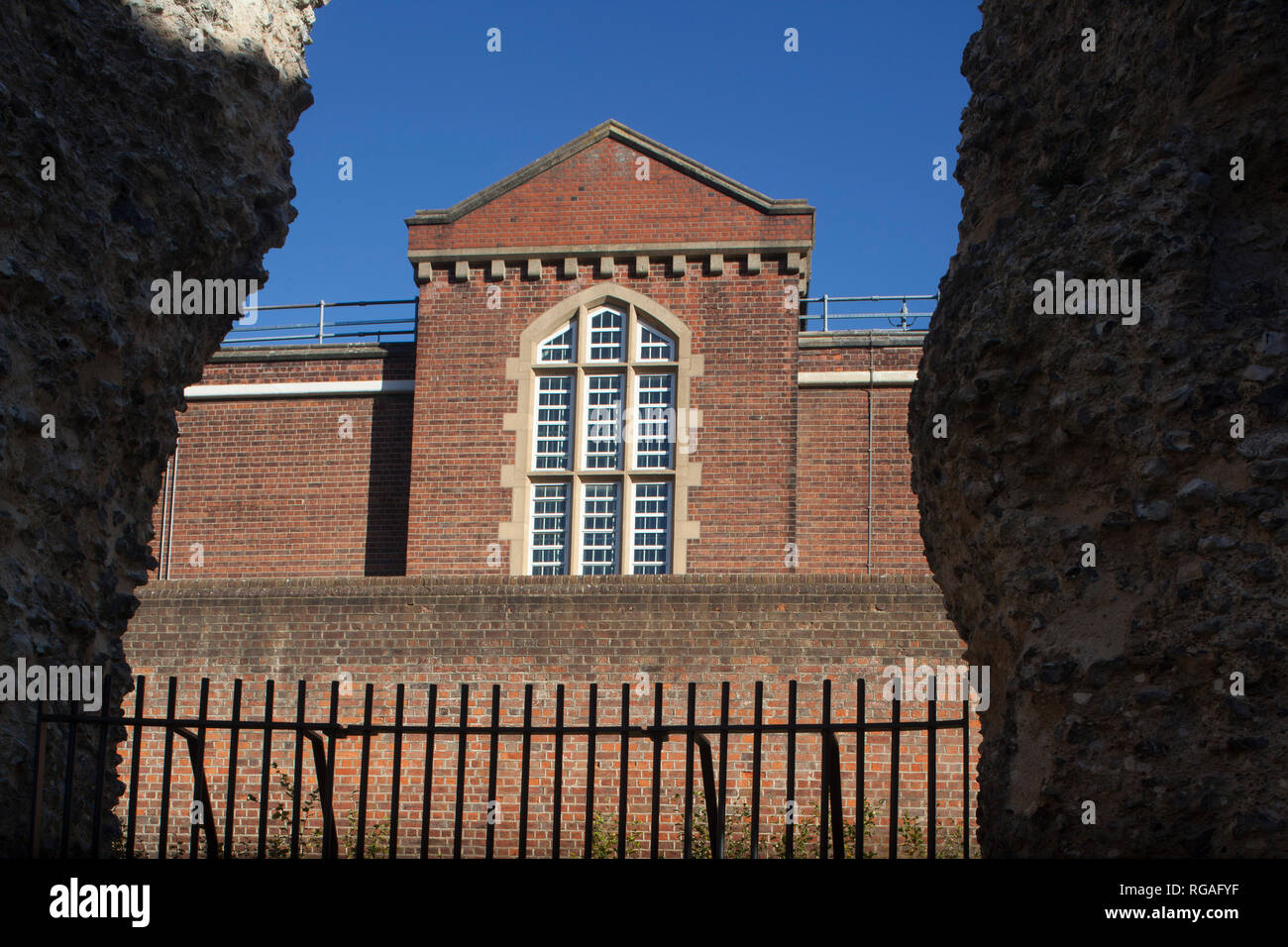 The main Victorian building of Reading Prison viewed through the ruins ...