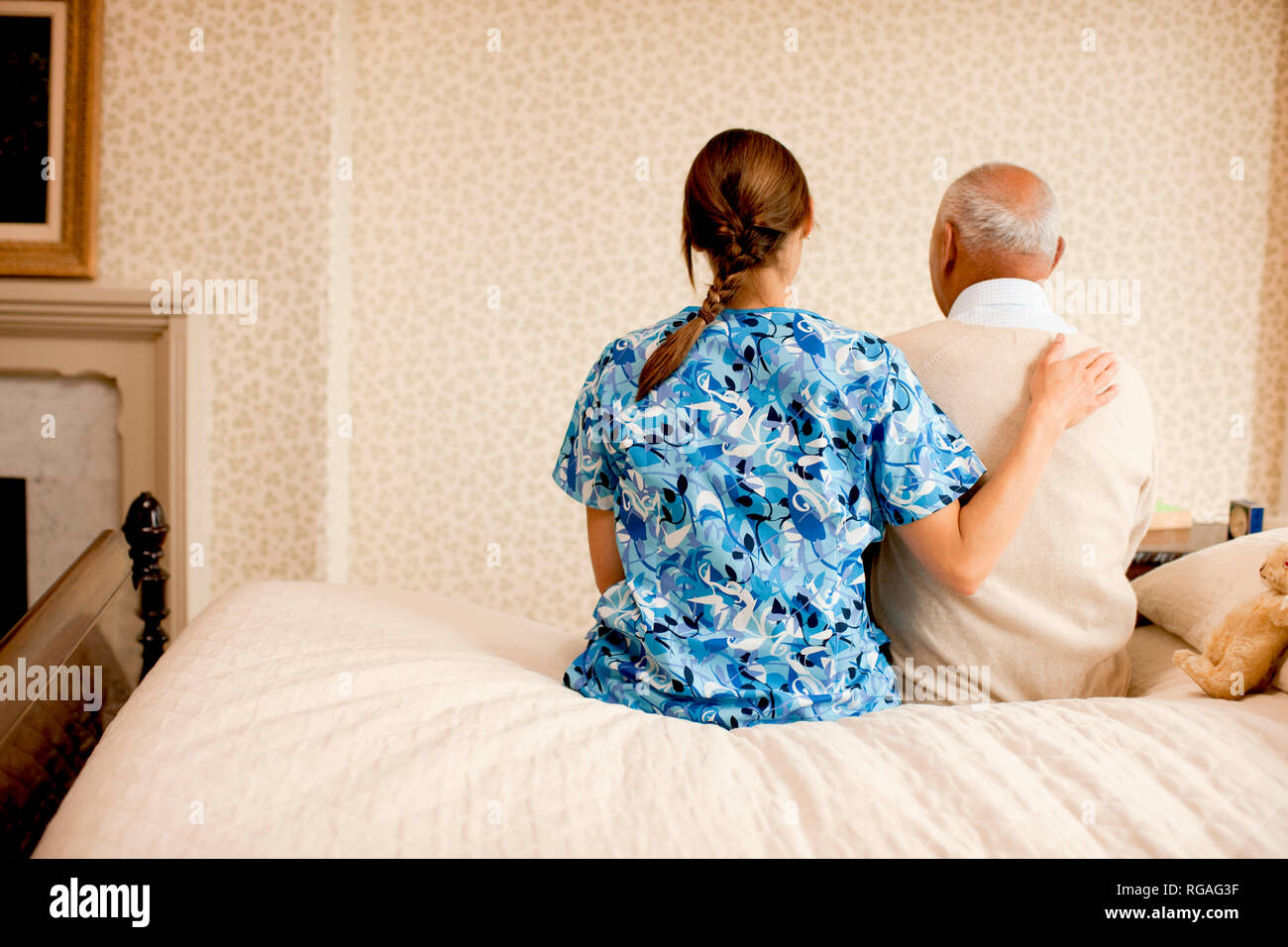 Unwell senior man receiving a visit from his nurse Stock Photo - Alamy