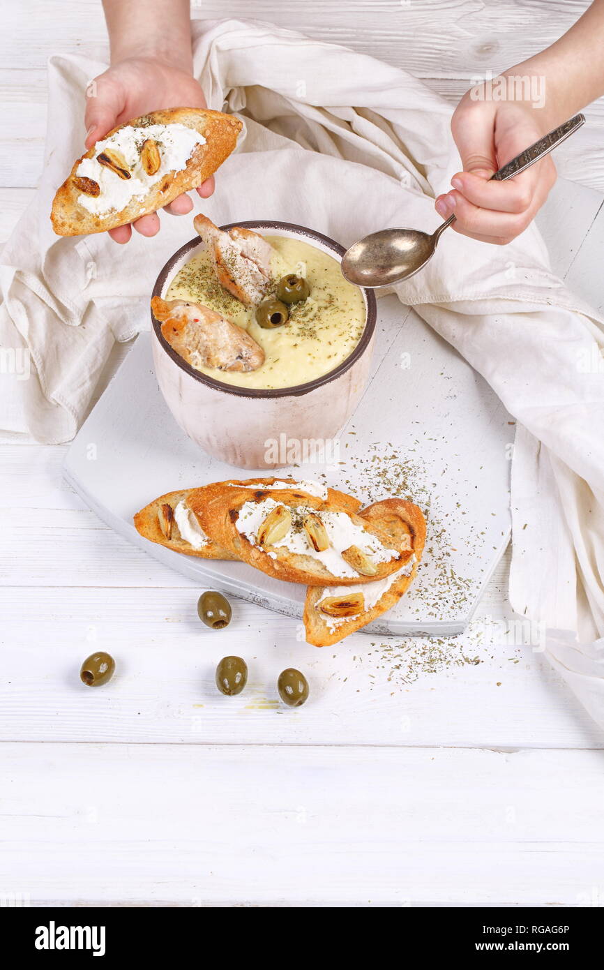 French puree soup with parsnip, soft cheese baguette. Holds a soft ...