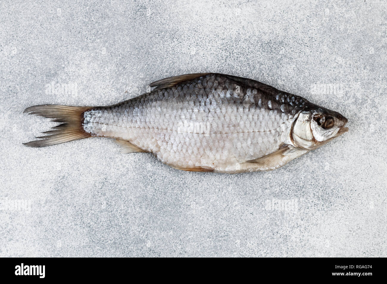 Dried salted fish on grey concrete background. Traditional Russian ...