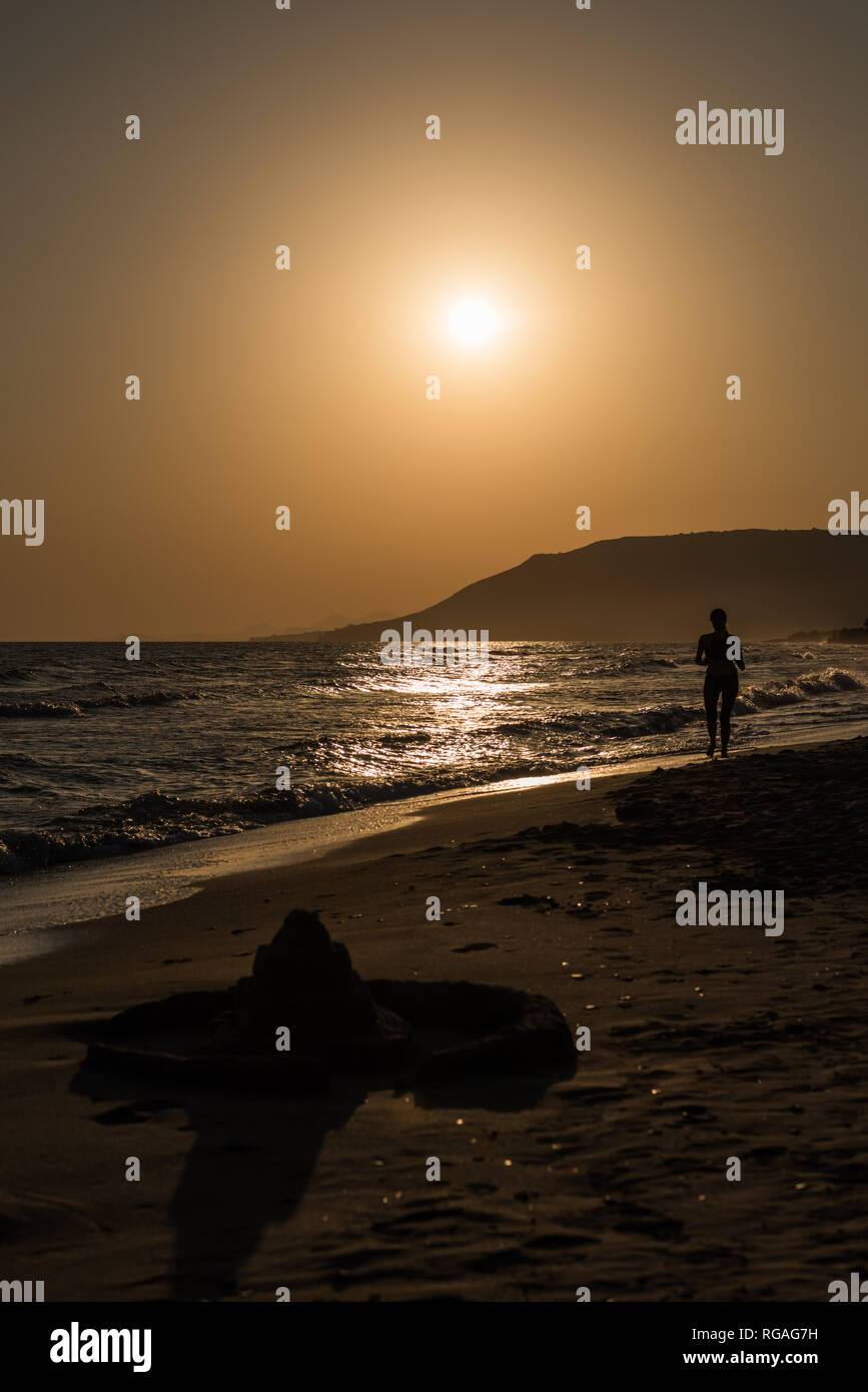 Female runner running on beach hi-res stock photography and images - Alamy
