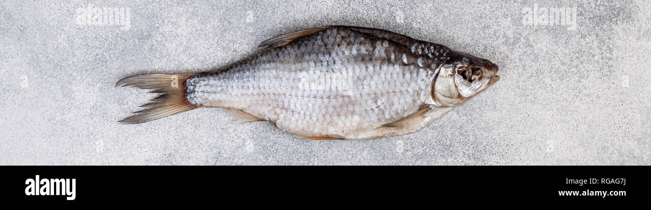 Dried salted fish on grey concrete background. Traditional Russian ...