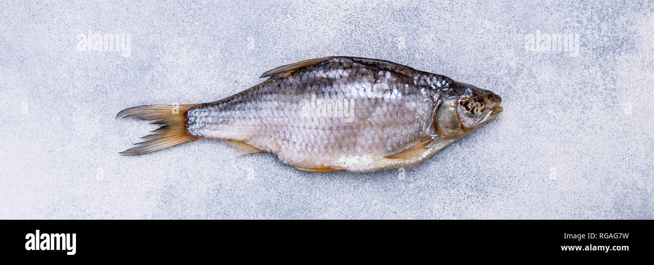 Dried salted fish on grey concrete background. Traditional Russian ...