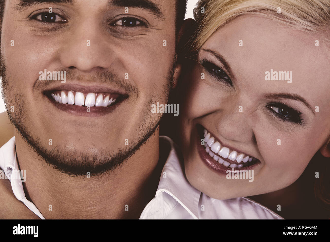 Joyful young couple embracing hi-res stock photography and images - Alamy